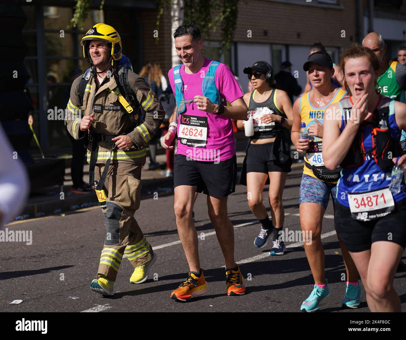 A runner wearing a Dorset & Wiltshire Fire and Rescue uniform during ...