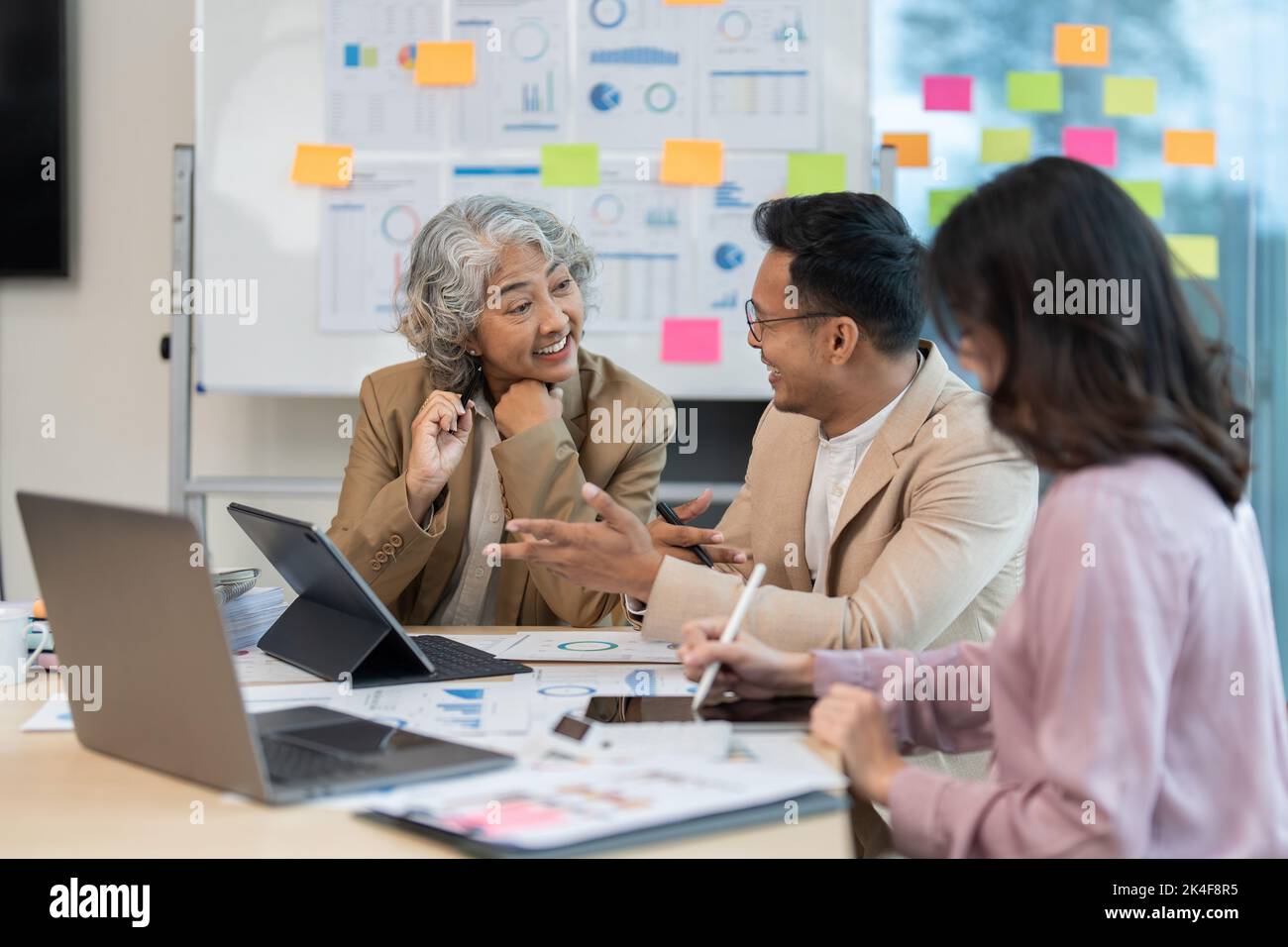 Group of Business people discuss a marketing strategy to improve the ...