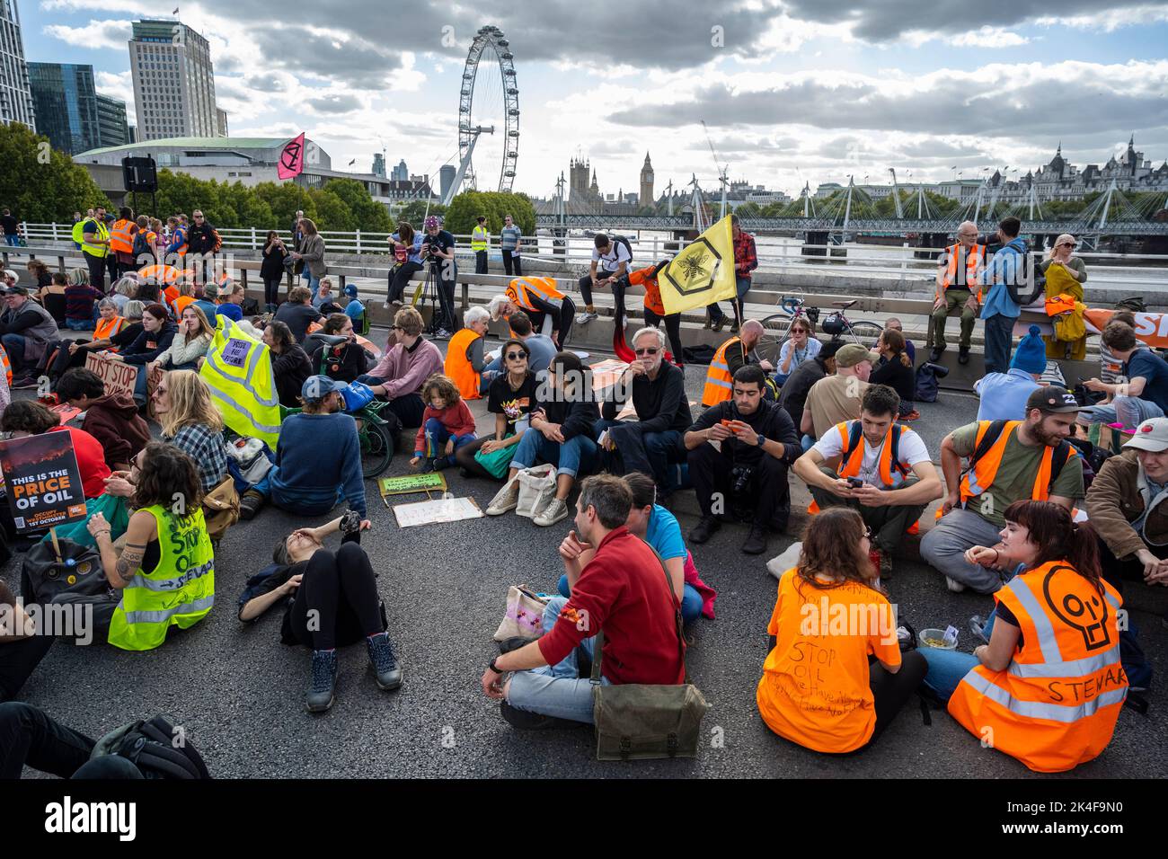 London, UK. 2 October 2022. Environmental activists stage a sit in Just ...