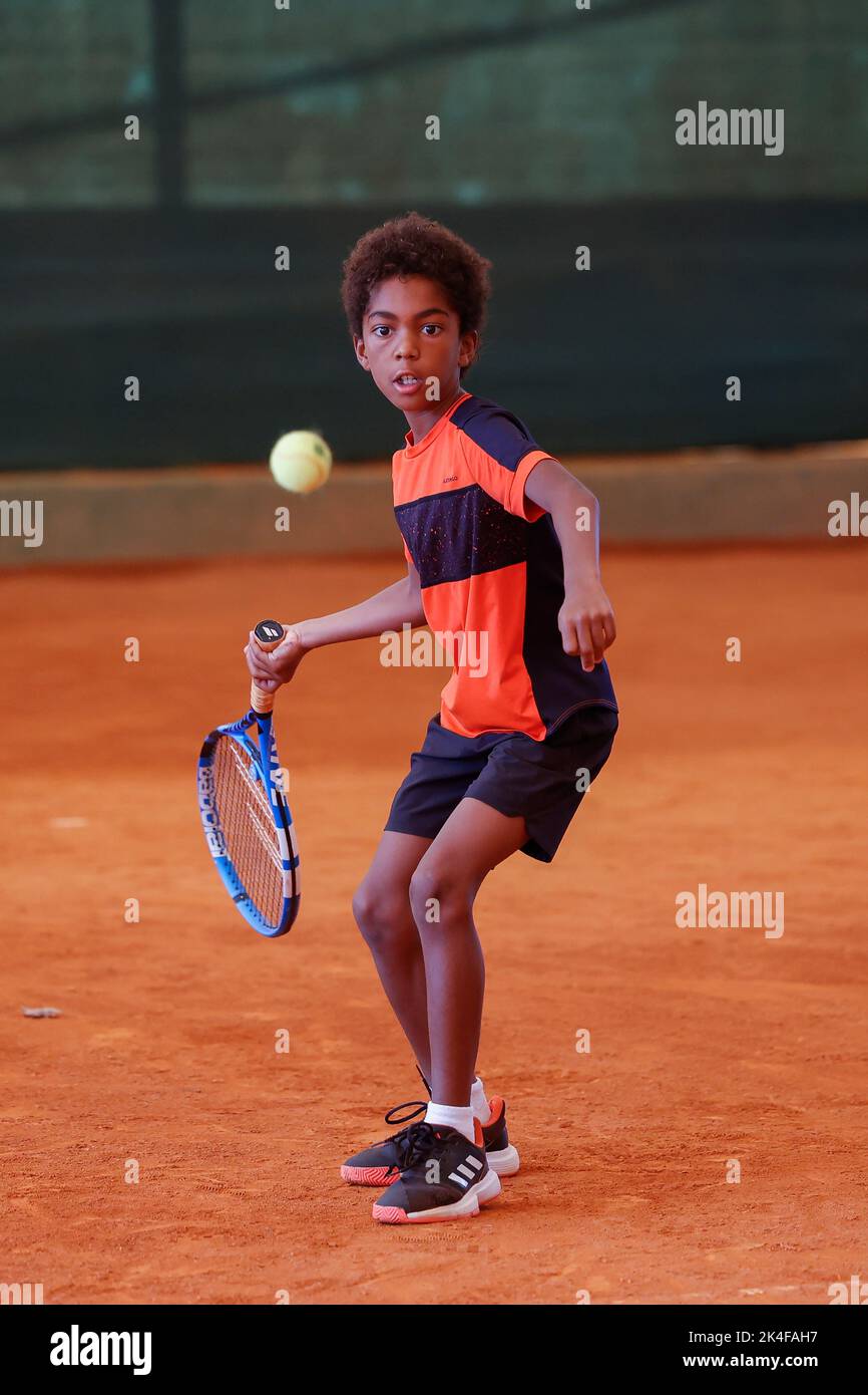 Young coloured boy playing tennis in Opatja, Croatia,Europe Stock Photo ...