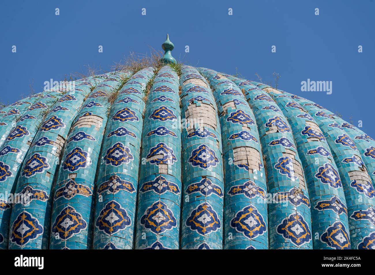 Zoom of Blue tile dome of Bibi-Khanym Mosque in bright blue sky in ...
