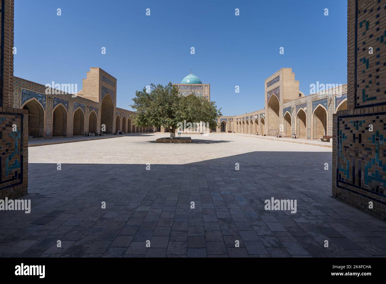 Kalan Mosque courtyard and blue-tiled dome, Bukhara Old Town Stock ...
