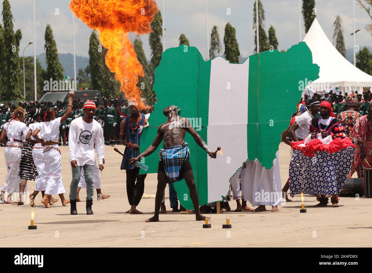 Abuja, Nigeria. October 1st 2022. A man perform with fire during the ...