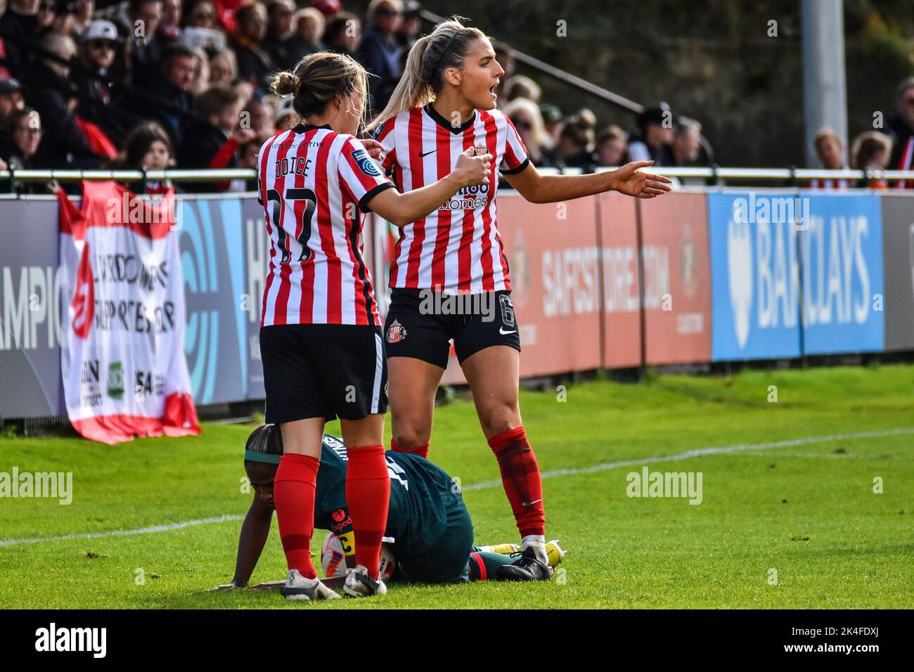 Louise Griffiths (right) and Abbey Joice of Sunderland Women protest to ...