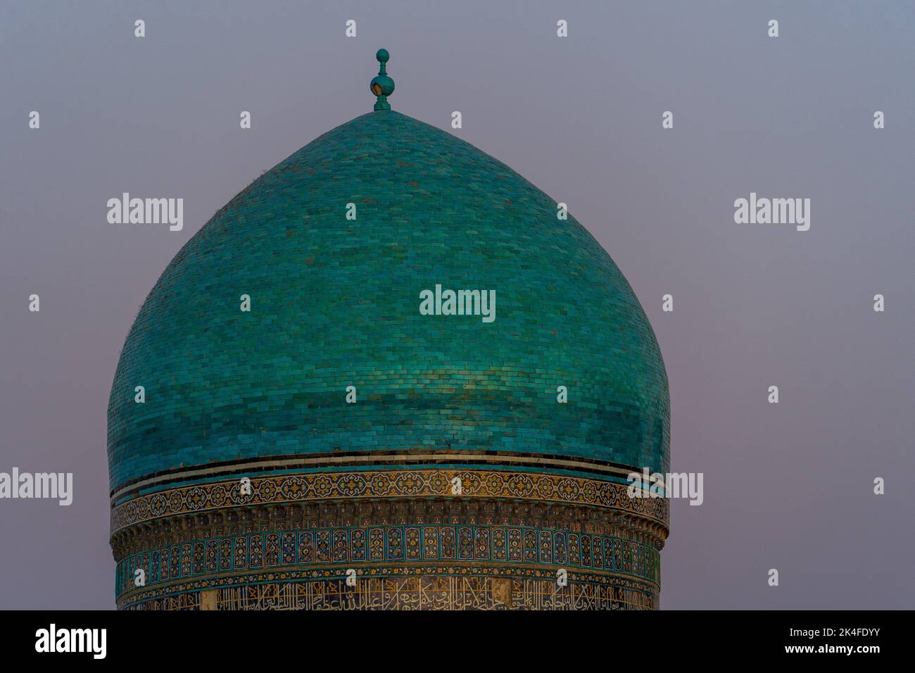 Emerald tiles of the Bukhara Kalan Mosque Blue dome at dusk Stock Photo ...