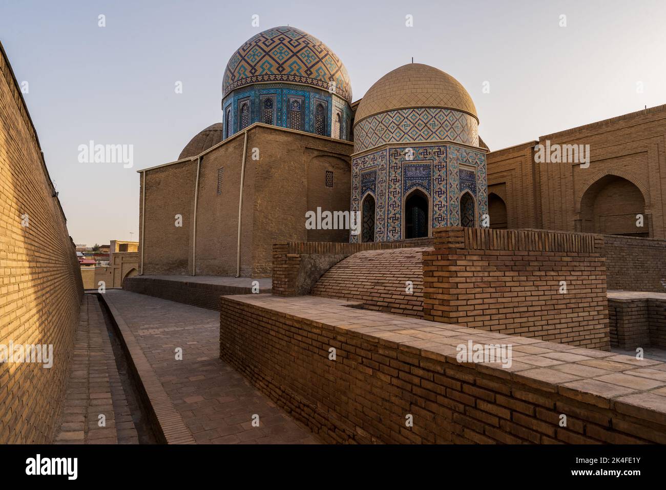 Golden and blue tiled domes in Shah-i-Zinda at sunset, Samarkand Stock ...