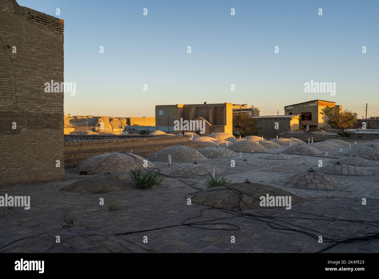 Sunrise view of roof-top vaults of Kalan Mosque and Mir-i-Arab Madrasa ...