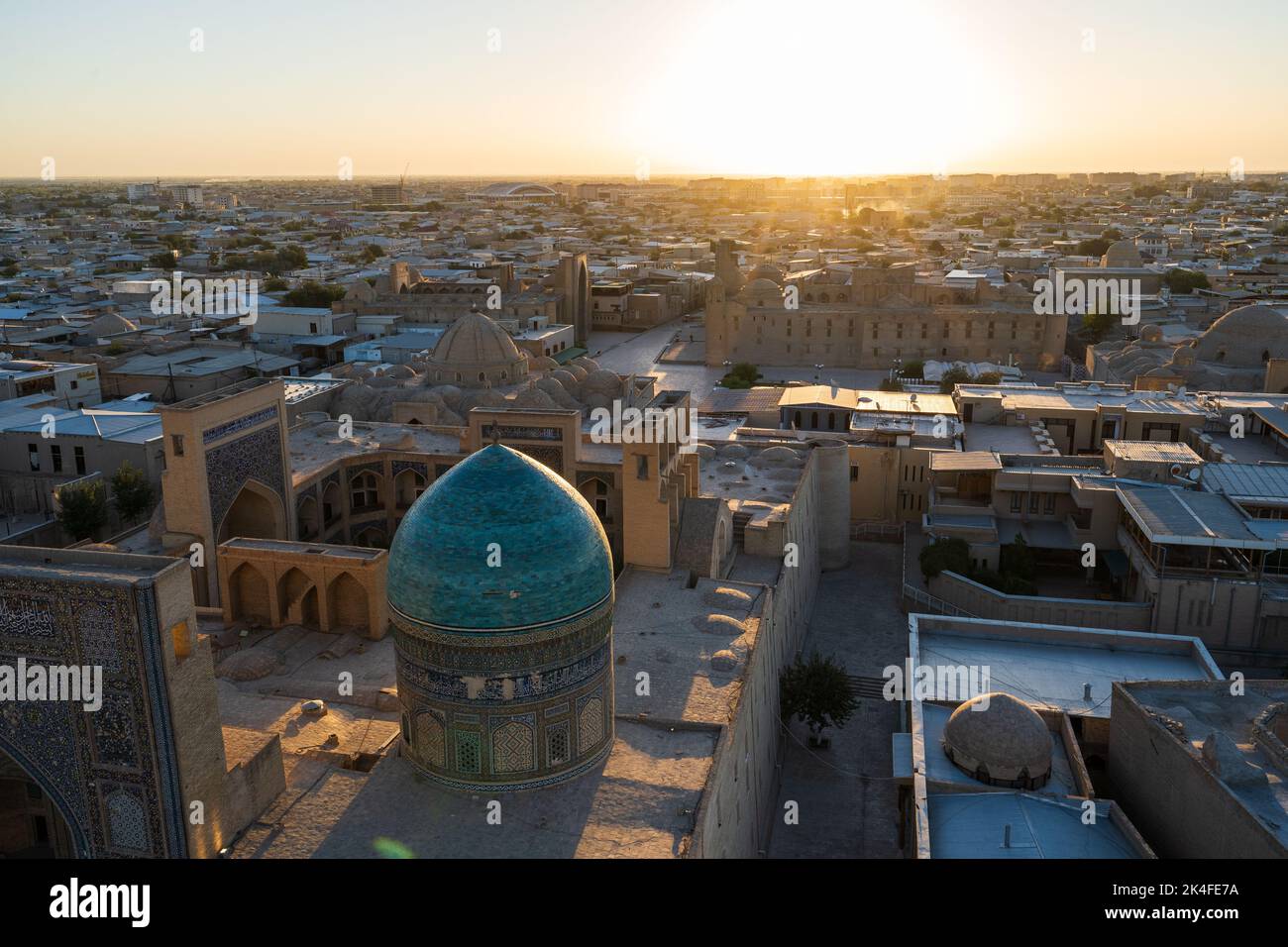 Sunrise view of roof-top vaults of Mir-i-Arab Madrasa from Kalon Minaret Tower, Bukhara Stock ...