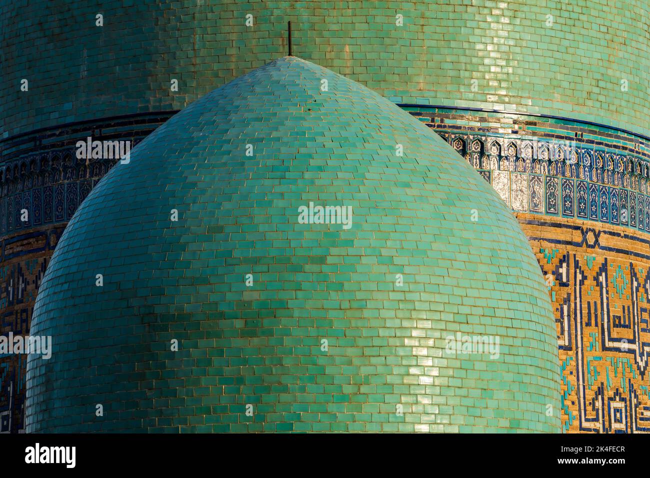 Close up of double blue-tiled dome towers at Shah-i-Zinda at sunset ...