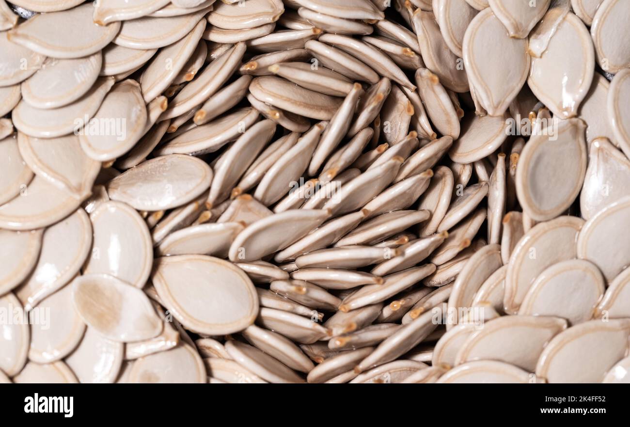 Pumpkin seeds creating a natural, spiral structure. Pure pumpkin seeds ...