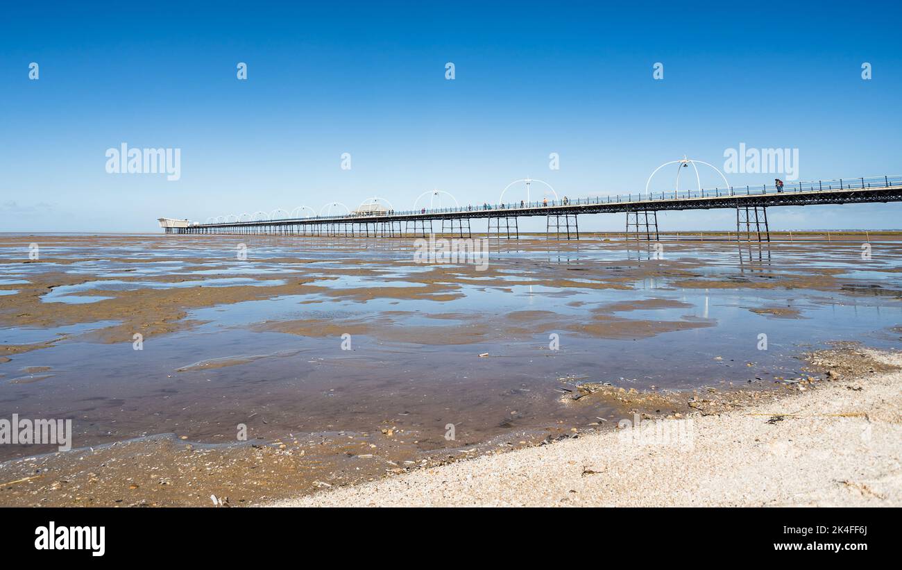 Pools of water in front of Southport Pier seen at low tide in October 2022 Stock Photo - Alamy