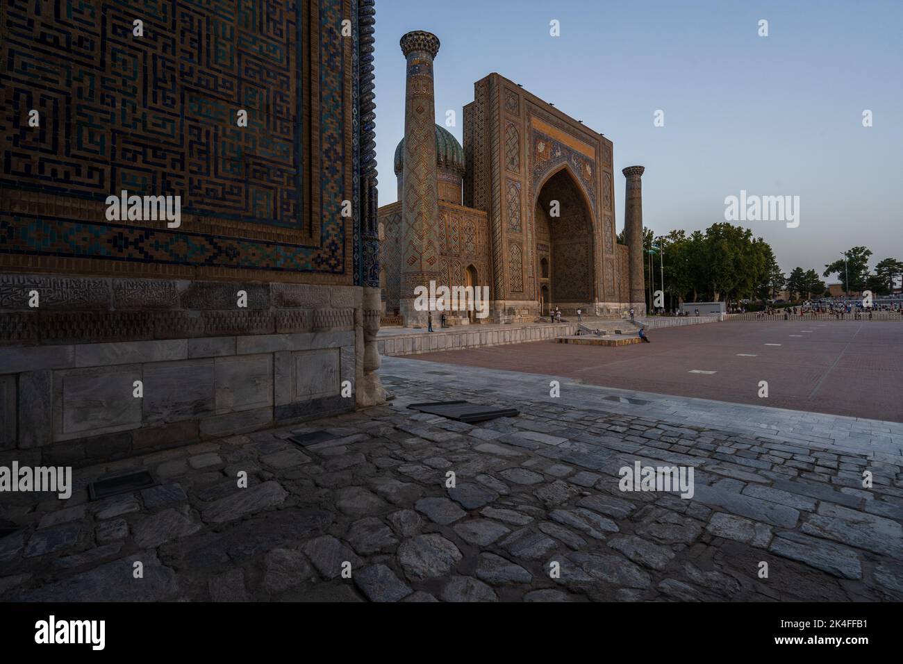Sherdor Madrassa in Registan Complex at sunset with beautiful blue ...