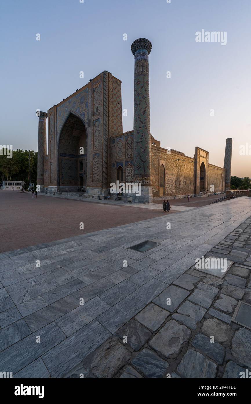 Sherdor Madrassa in Registan Complex at sunset with beautiful blue ...