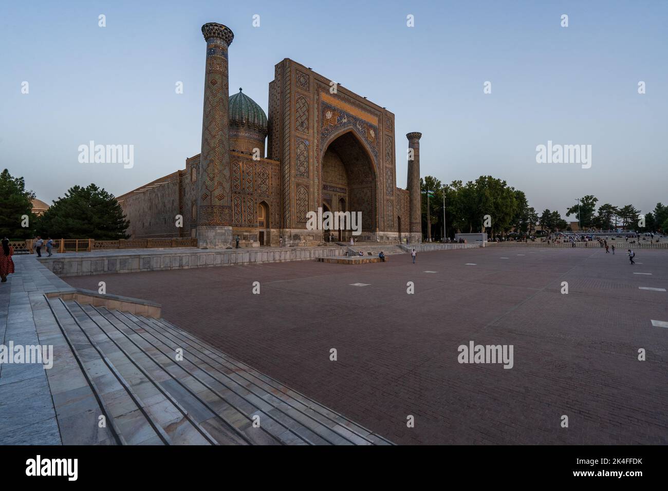 Sherdor Madrassa in Registan Complex at sunset with beautiful blue ...