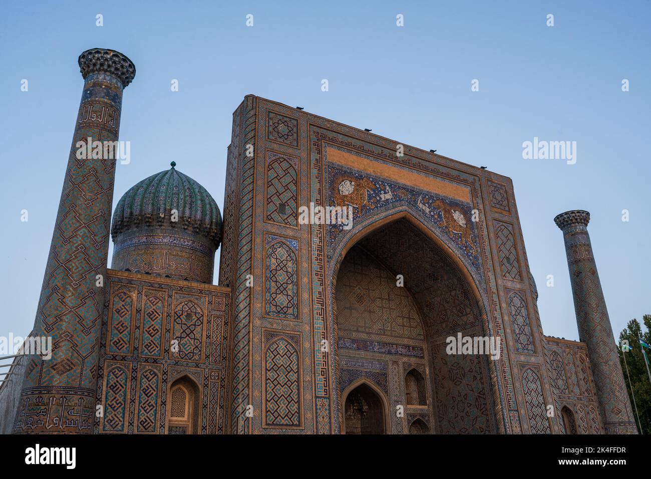 Sherdor Madrassa in Registan Complex at sunset with beautiful blue ...