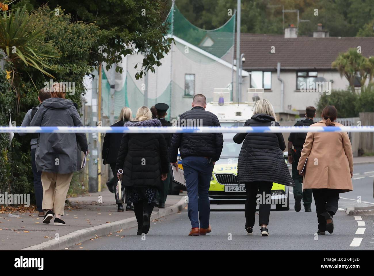 PSNI detectives arrive at the scene following a shooting at the ...