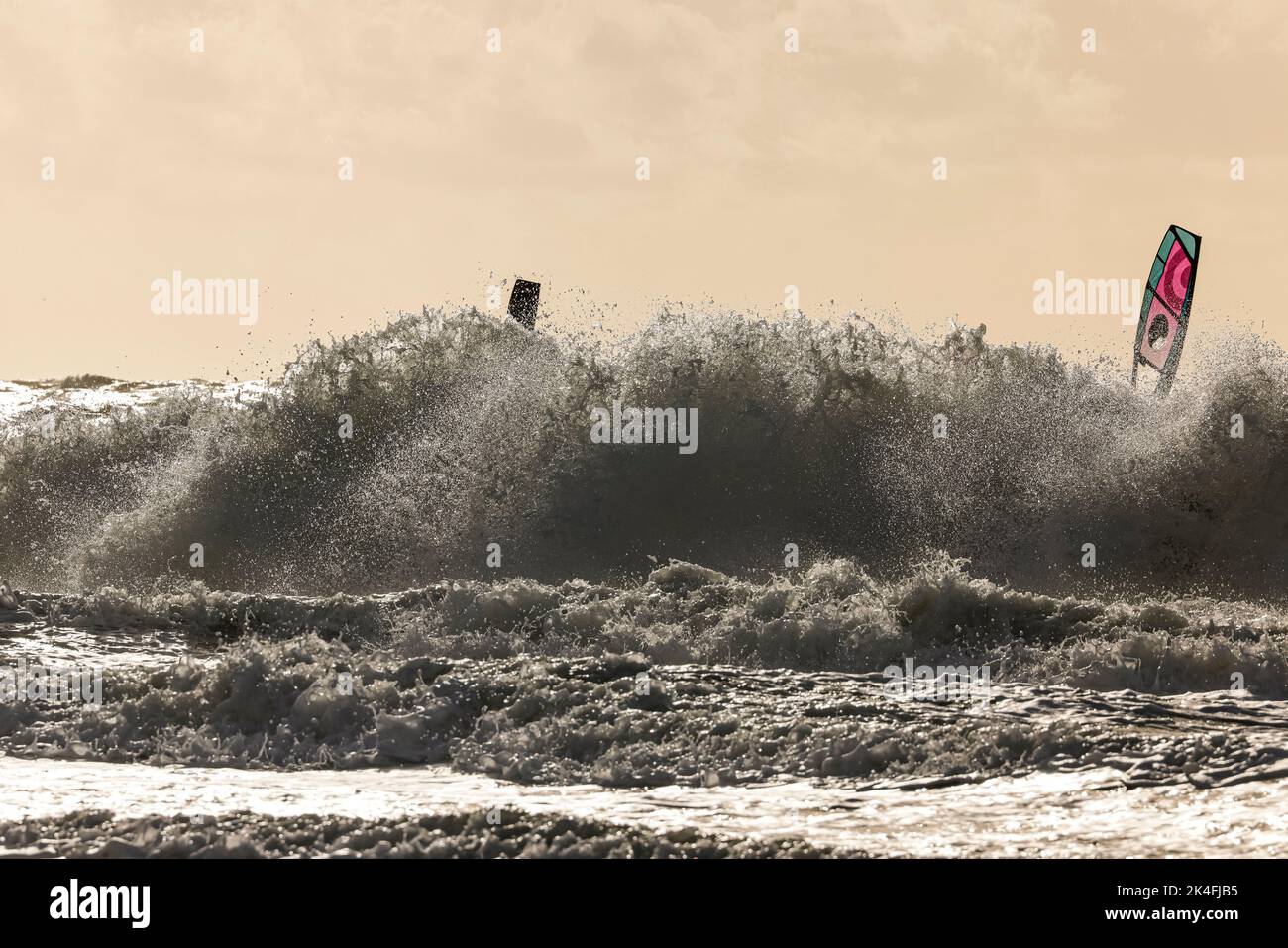 02 October 2022, Schleswig-Holstein, Westerland/Sylt: Two windsurfers ...