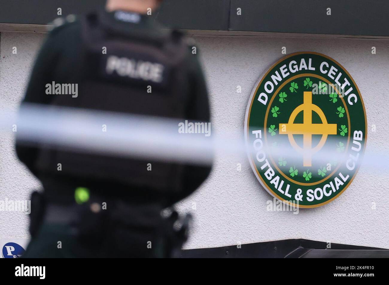 An officer from the PSNI at the scene following a shooting at the ...