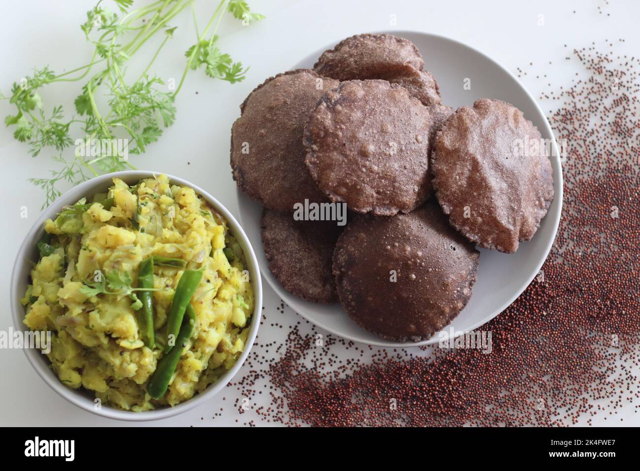 Ragi Poori served with spiced mashed potatoes as side dish. Deep fried ...