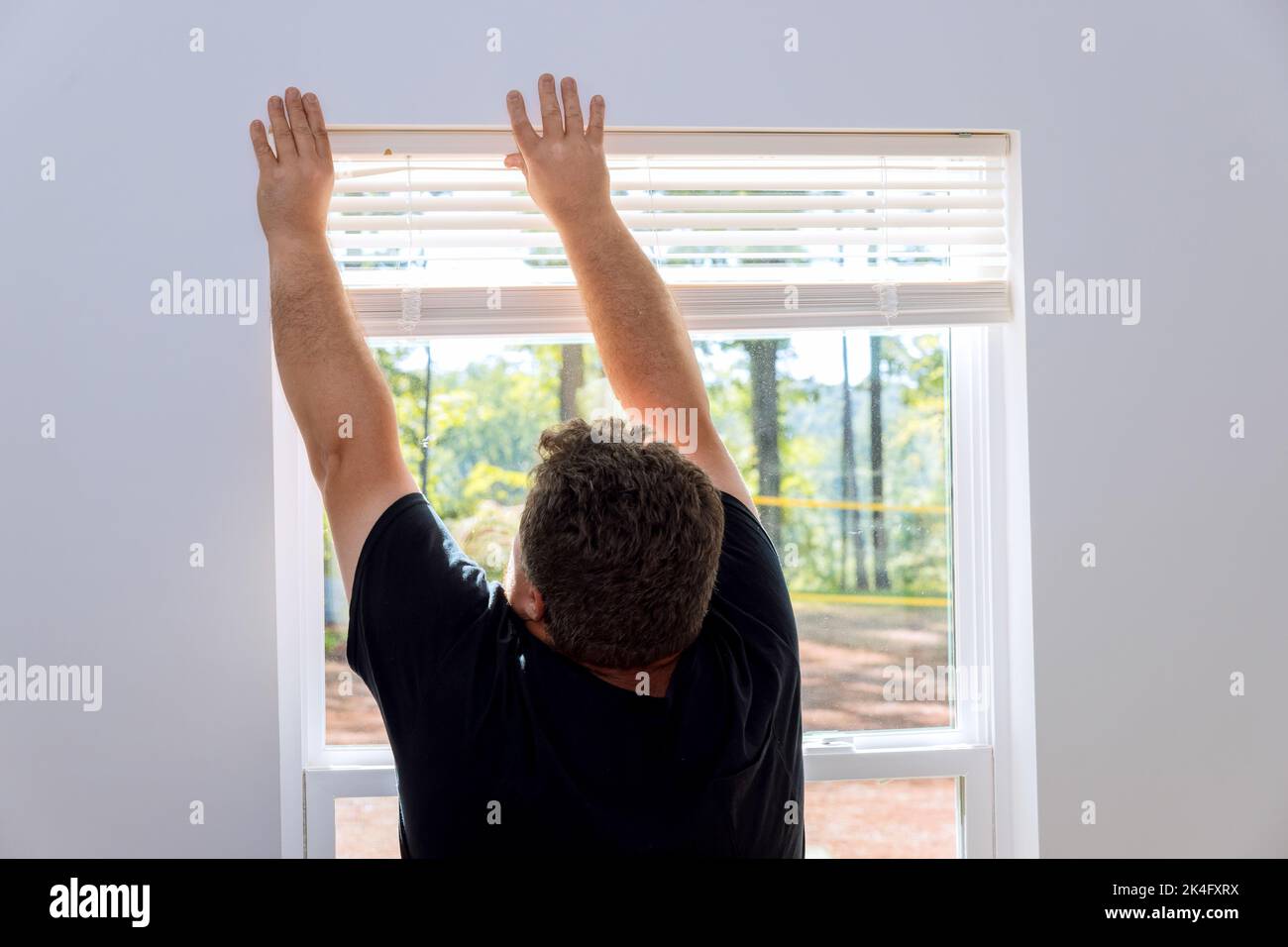 An installation of window blinds on a newly constructed home was ...
