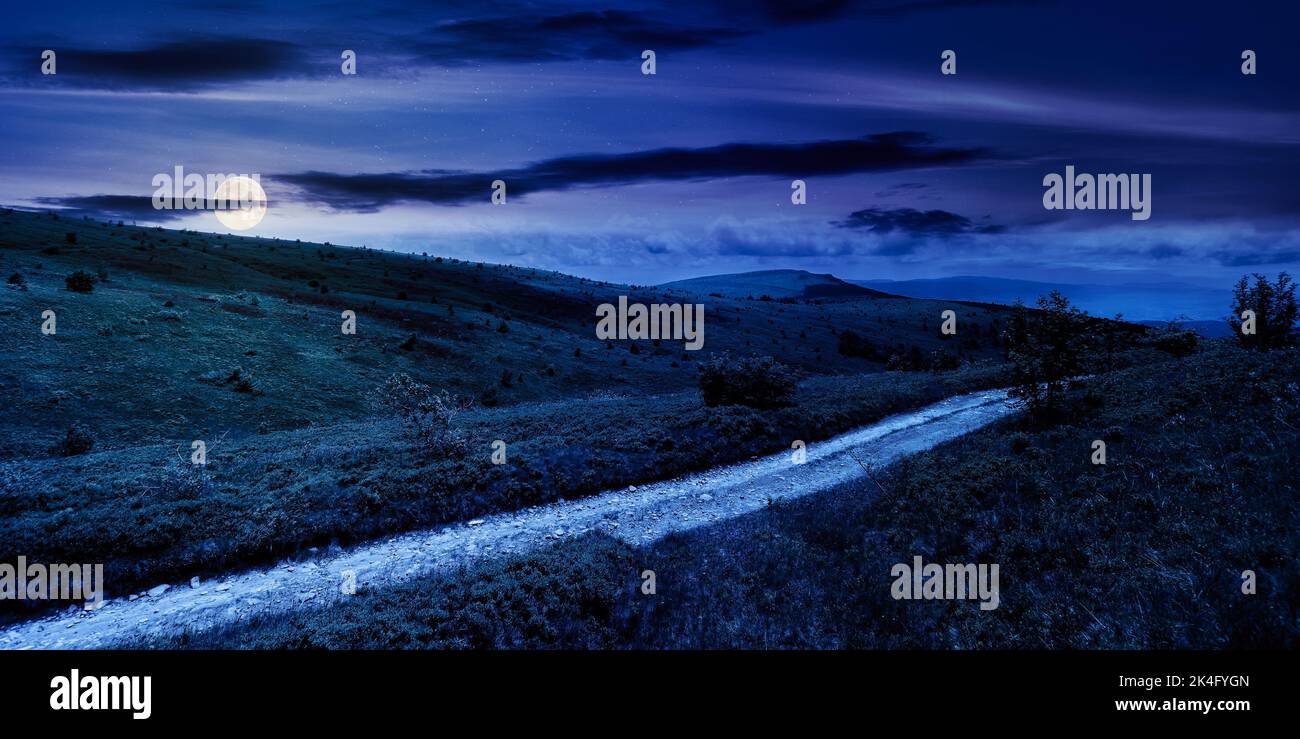 carpathian mountain landscape in summer at night. dirt road and hiking ...