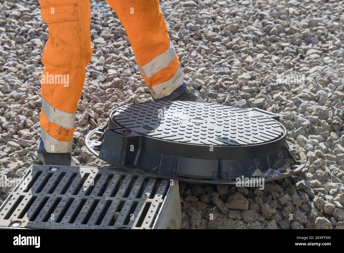 Installing cast iron sewer hatch on a concrete base of installation of ...
