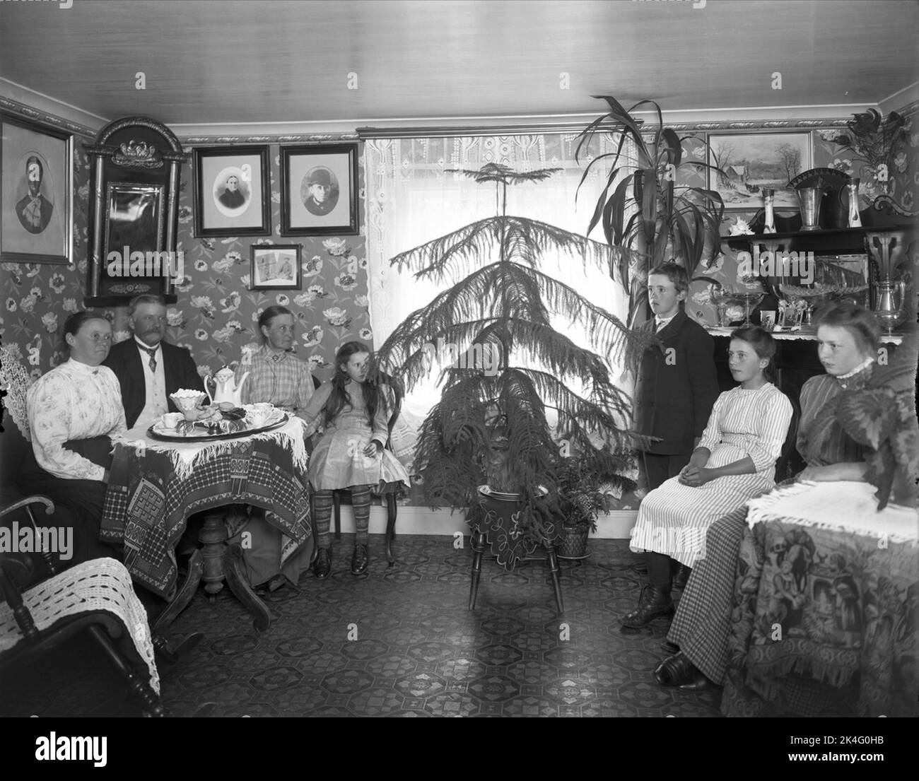 Interior, with seven people. Mining Sven Engström with his wife Maria ...