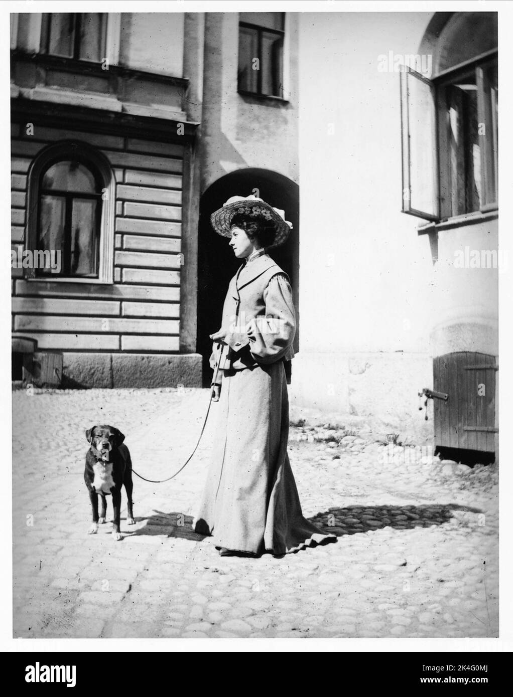 Woman holds on hat Black and White Stock Photos & Images - Alamy