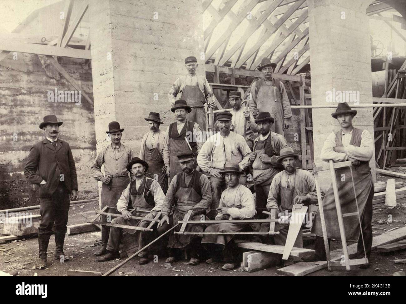 The Nordic Museum under construction. Work team with men in aprons and ...