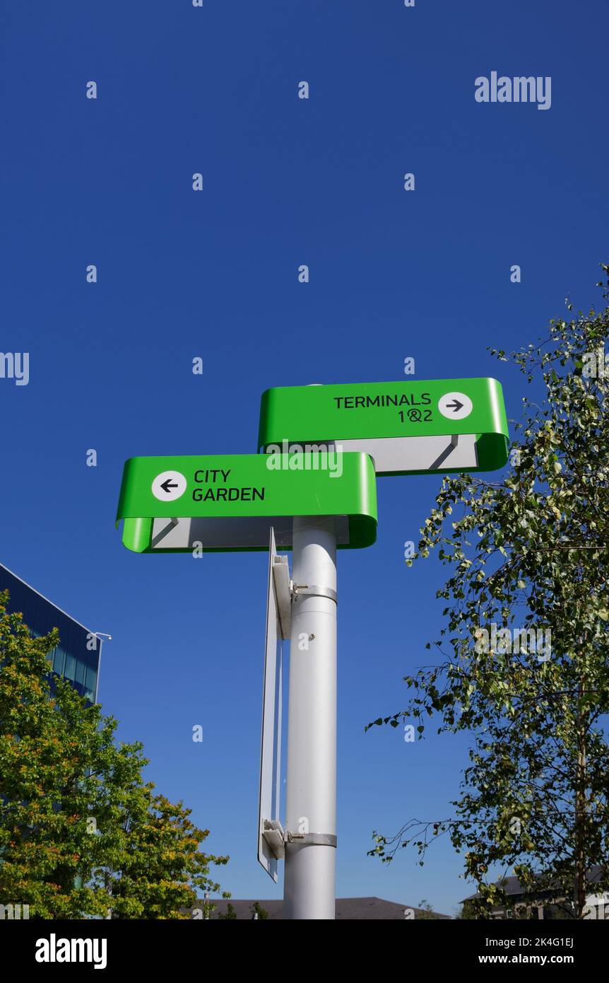 Vertical photo of modern looking signpost in Dublin Airport Central ...