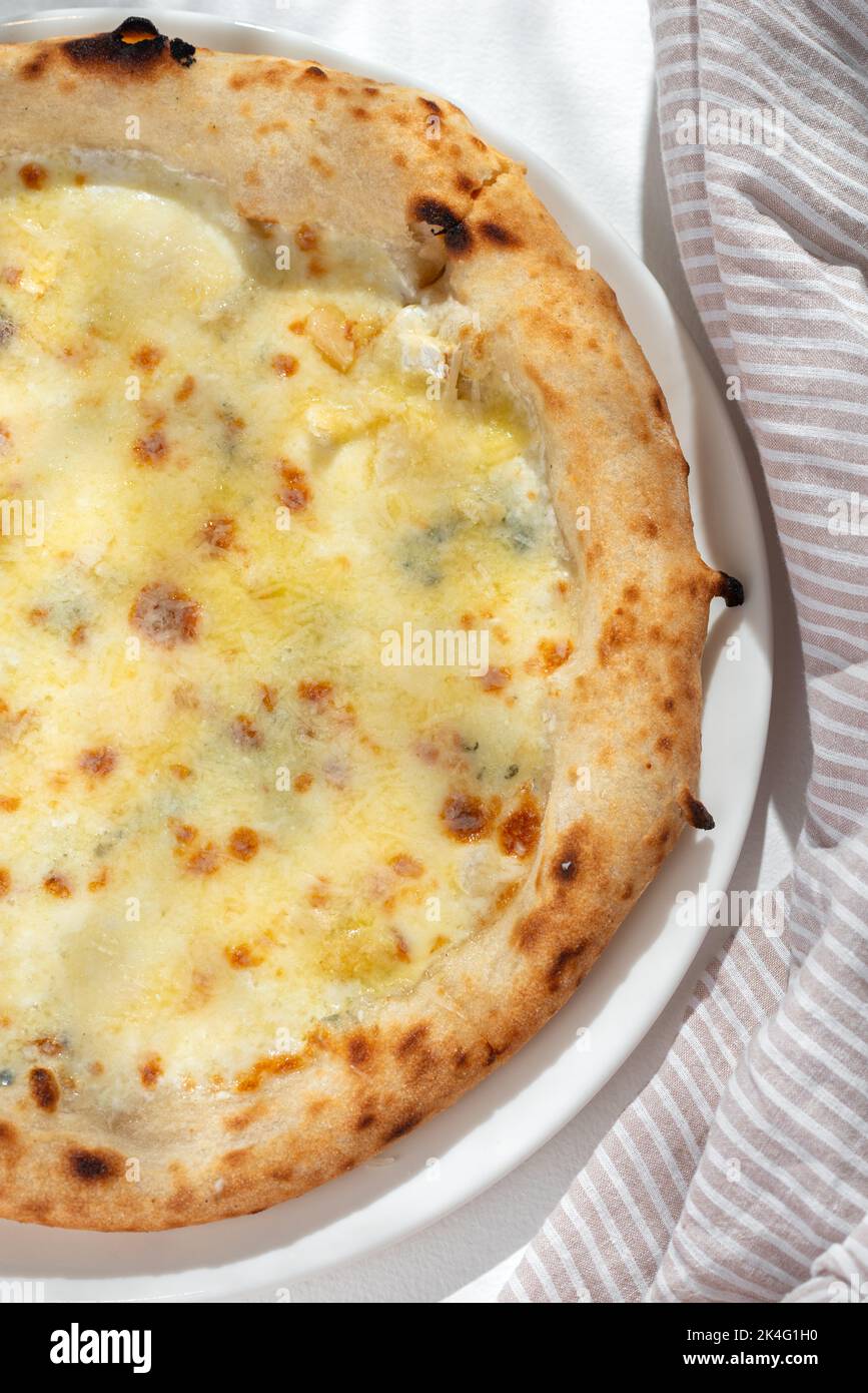 Cinque Formaggi or Five-Cheese Pizza on white background for restaurant ...