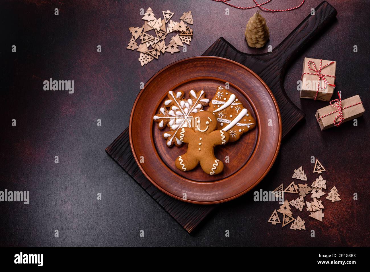Beautiful gingerbread on a brown ceramic plate with Christmas tree ...