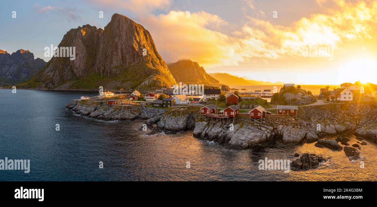 Red wooden huts, known as Rorbu, in the village of Reine on the Hamnoy ...