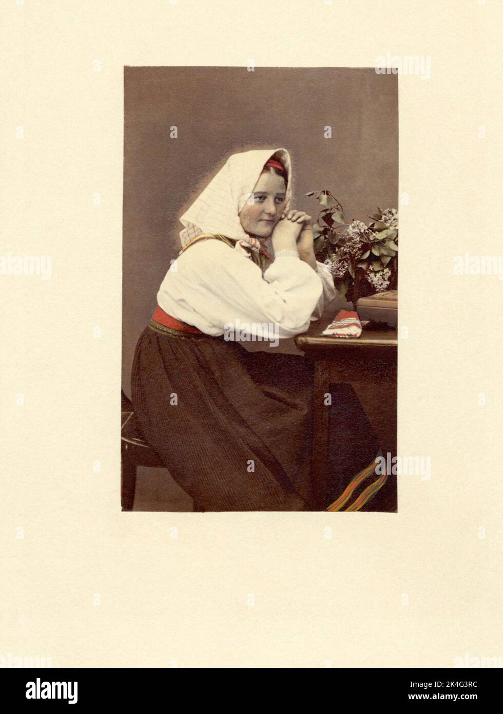 Portrait of sitting young girl in national costume from Dalarna ...