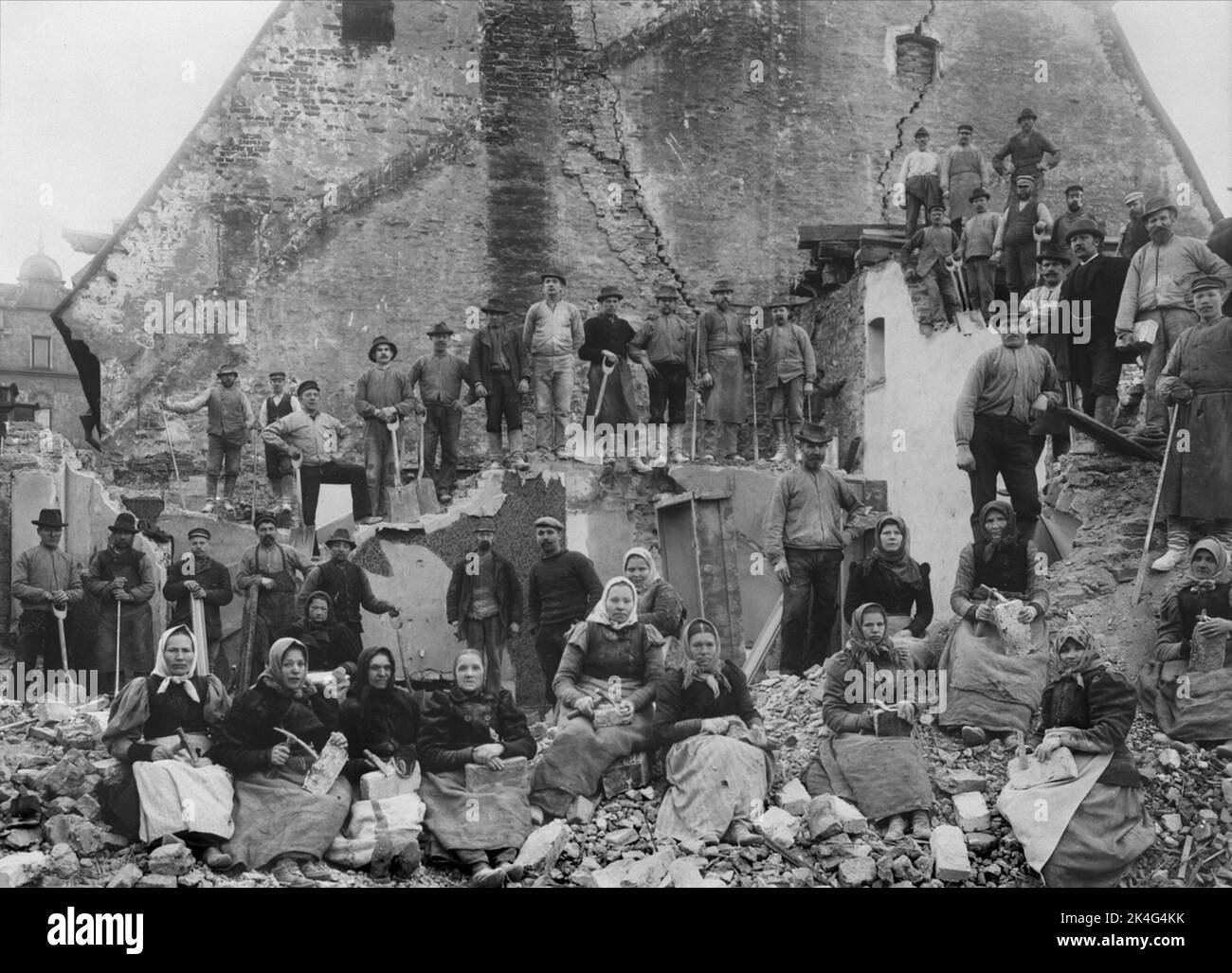 Demolition of houses. A large team consisting of women and men with ...