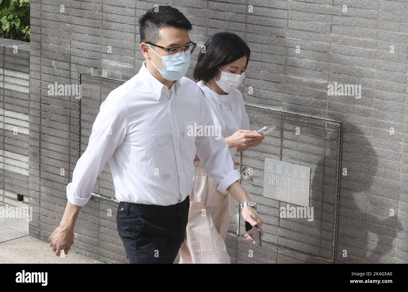 (L-R) Dr Chiu Ming-yu and Dr Vivien Chuang Wai-man are charged with theft, appeared in Kowloon ...