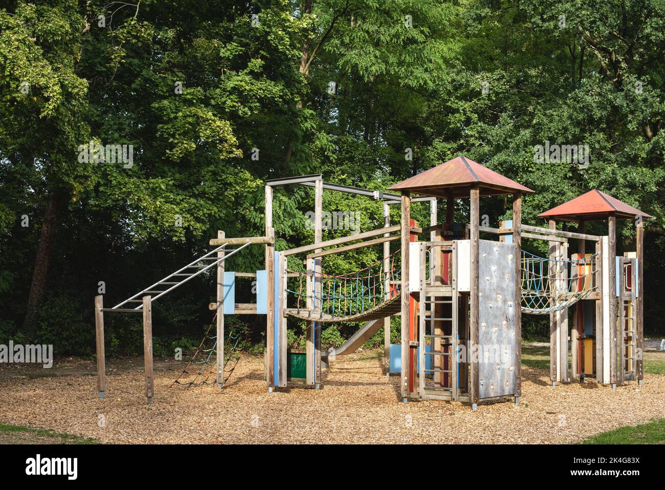 Children's wooden playground recreation area at public park. Children's ...