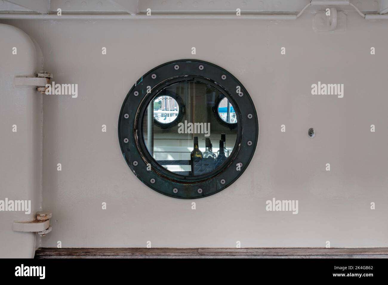 Drunkenness on ship during voyage. Alcohol bottles inside cabin visible ...