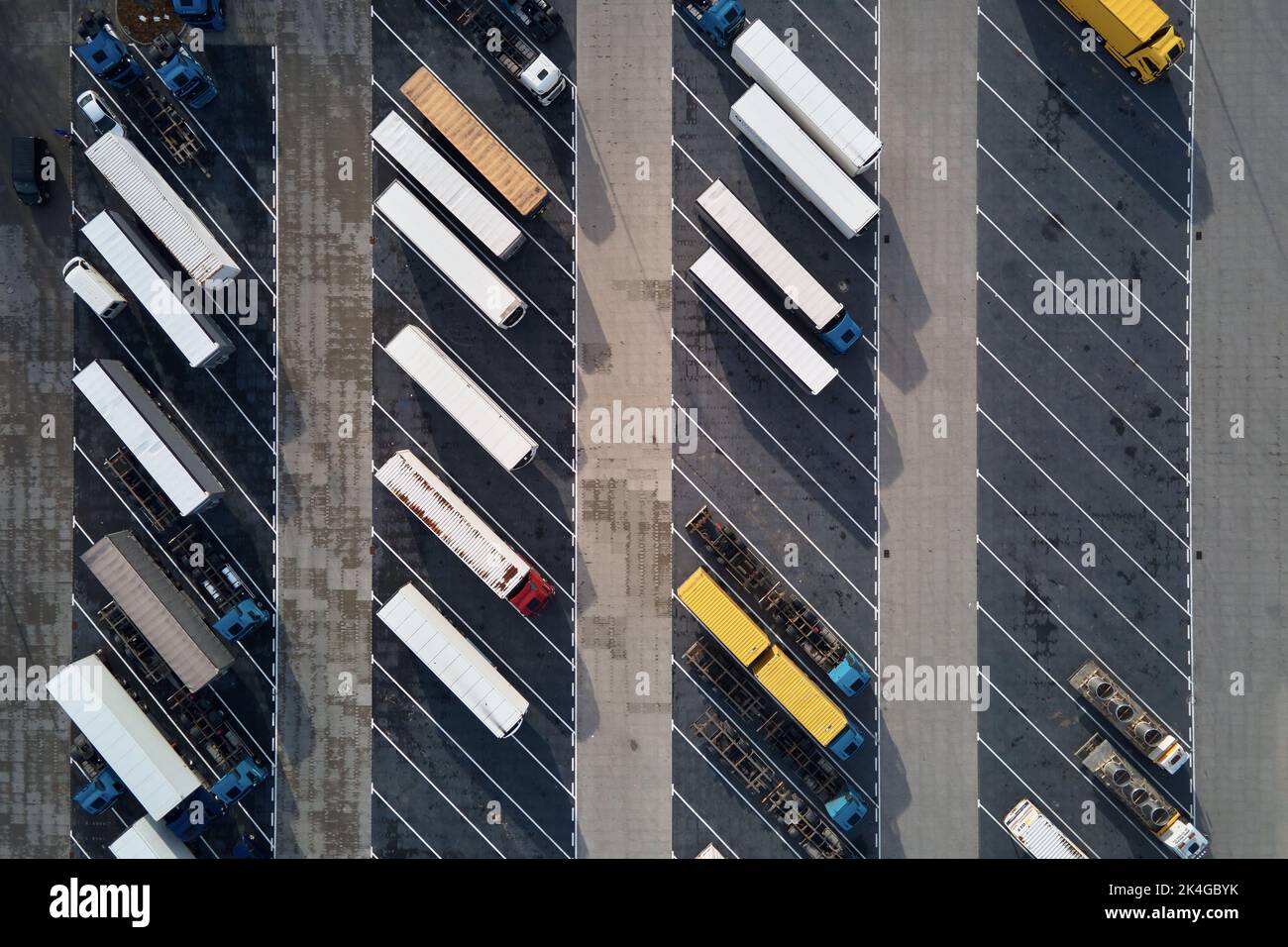 Top view of semi trucks waiting for loading at parking lot at logistic ...