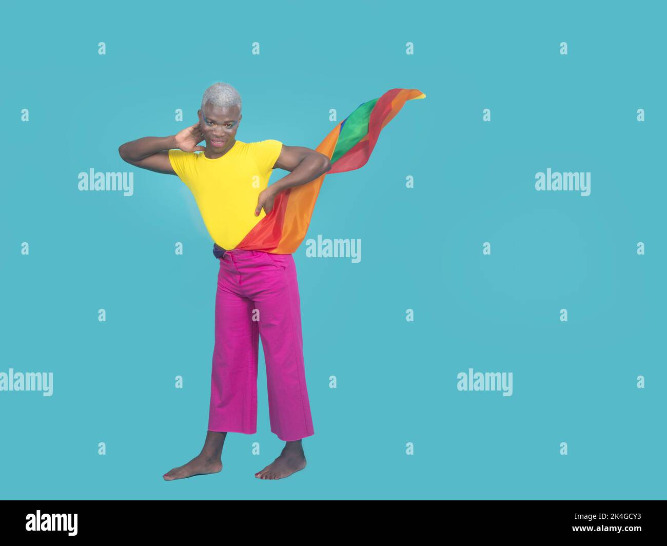 Full body positive black man with LGBT flag fluttering on waist ...