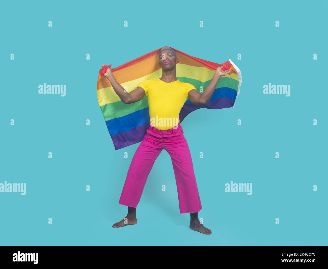 Full body barefoot African American man in colorful clothes with makeup ...