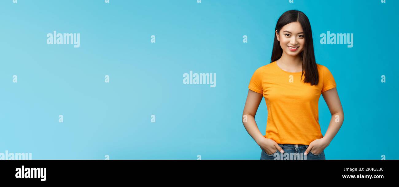 Confident assertive smiling asian woman stand blue background look ...