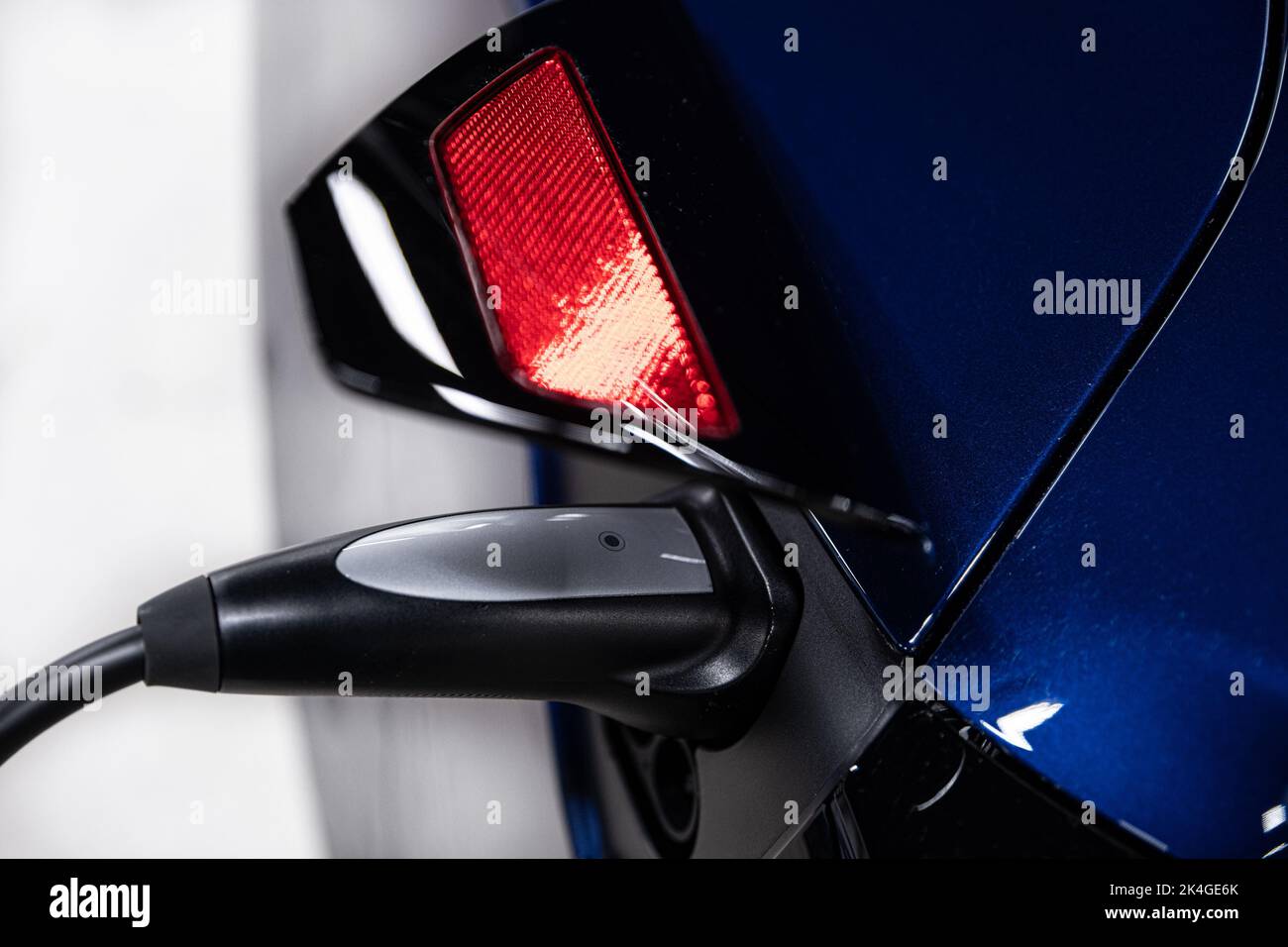 Electric plug connected to the electric car' Stock Photo - Alamy