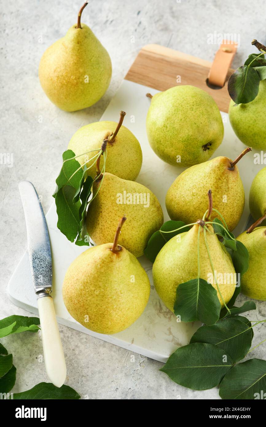 Pears. Fresh sweet organic pears with leaves on stand or plate on old ...