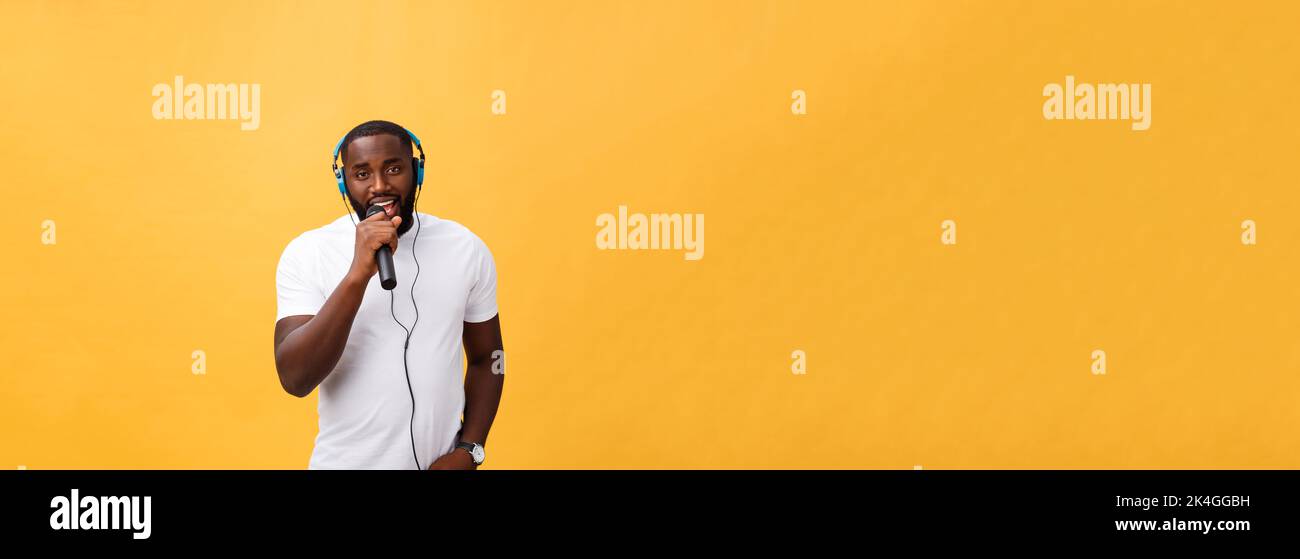 Portrait of cheerful positive chic handsome african man holding ...