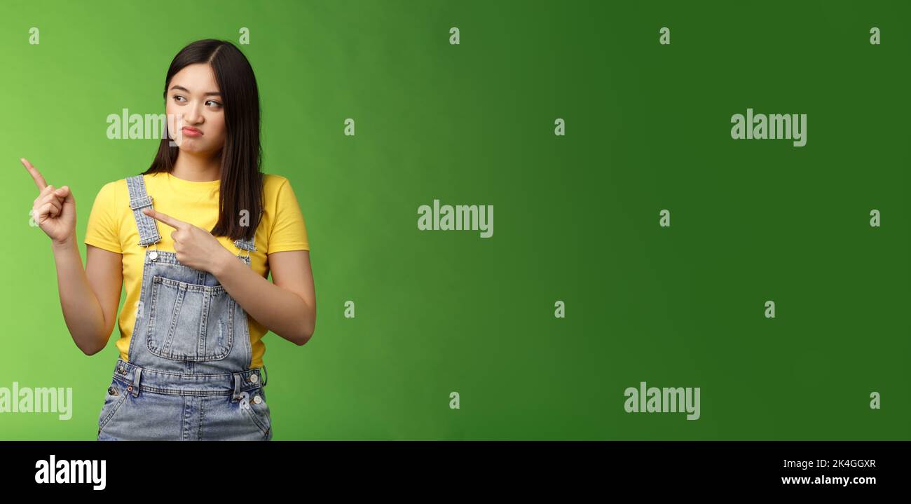 Upset cute asian female student pulling face regret shame, pity missing ...