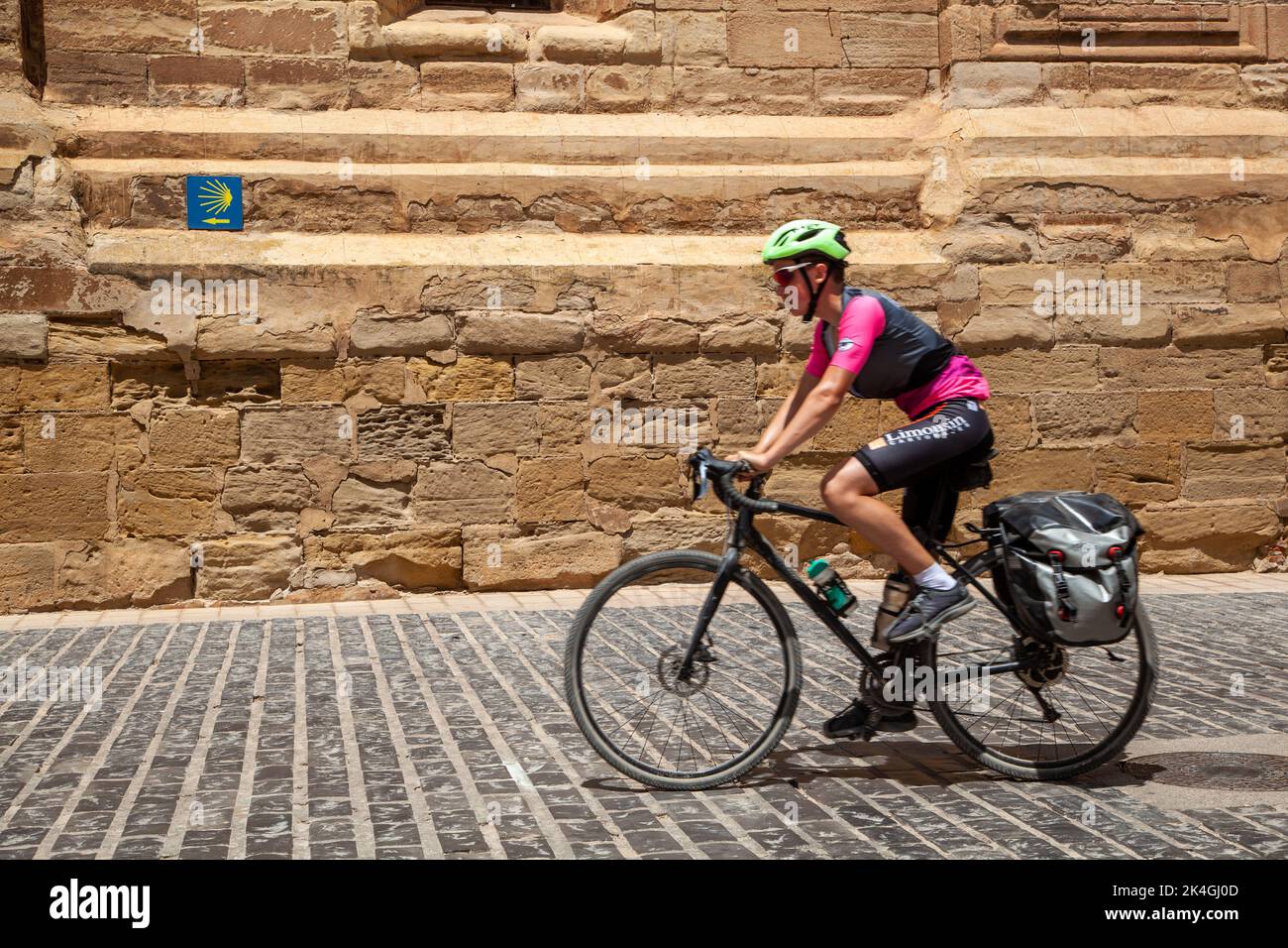 Pilgrim cyclist riding through the Spanish town of Navarrete La Rioja ...