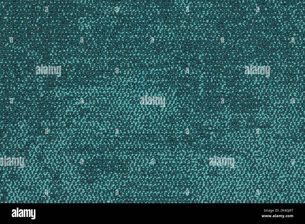 Close up of fabric textile carpet background with pattern, green color ...