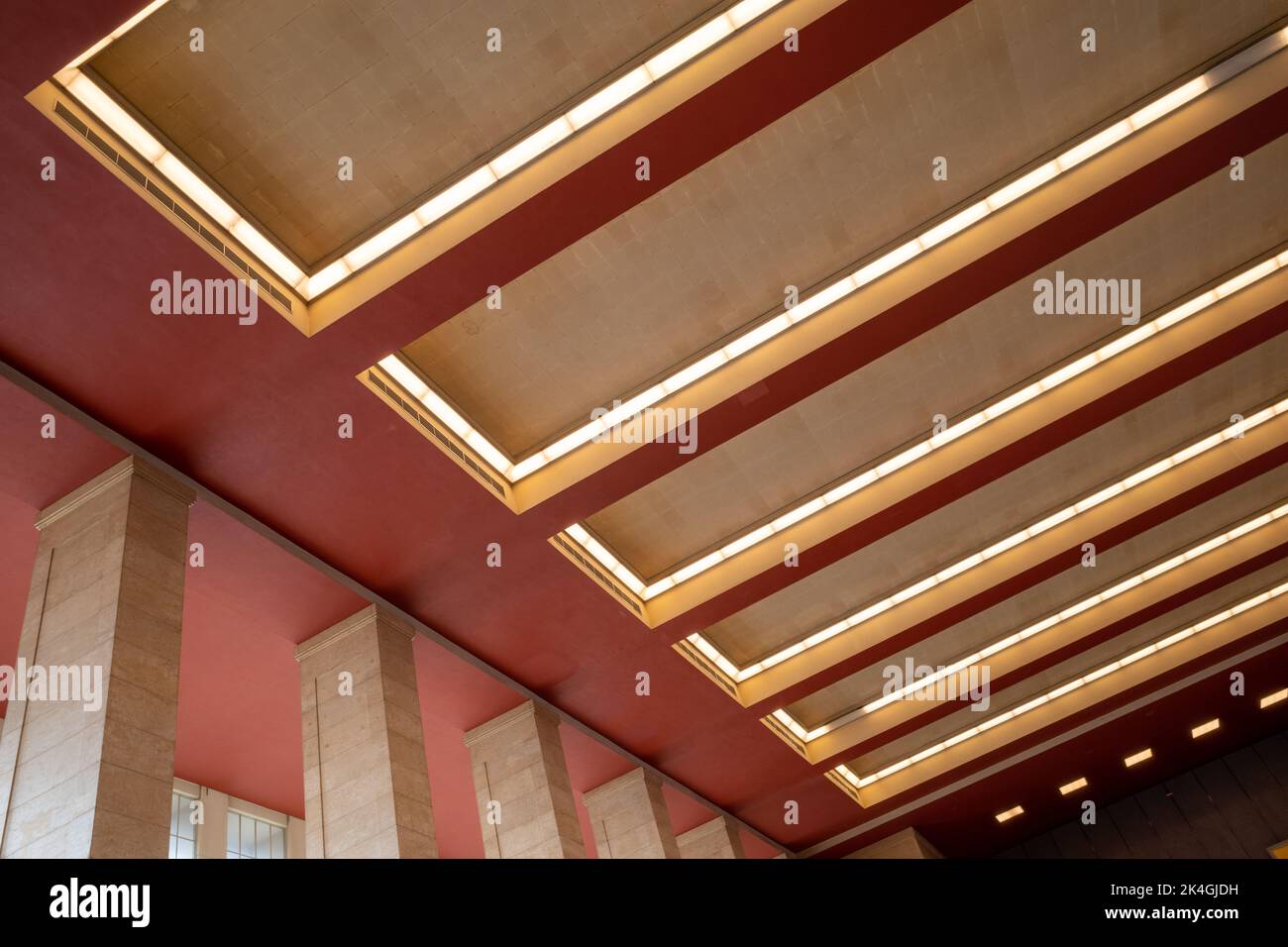 View under high ceiling of open interior space with huge concrete ...