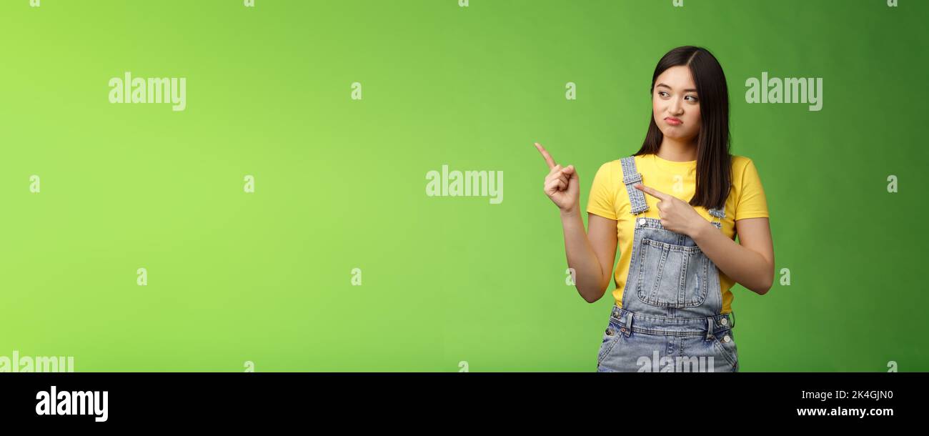 Upset cute asian female student pulling face regret shame, pity missing ...